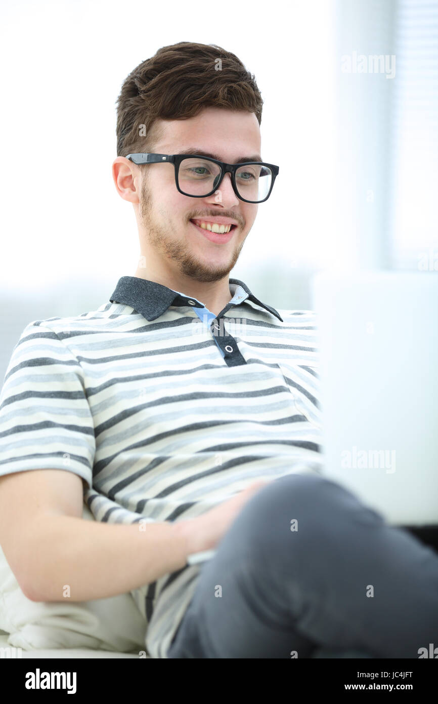 Young man using his laptop, close up Stock Photo - Alamy