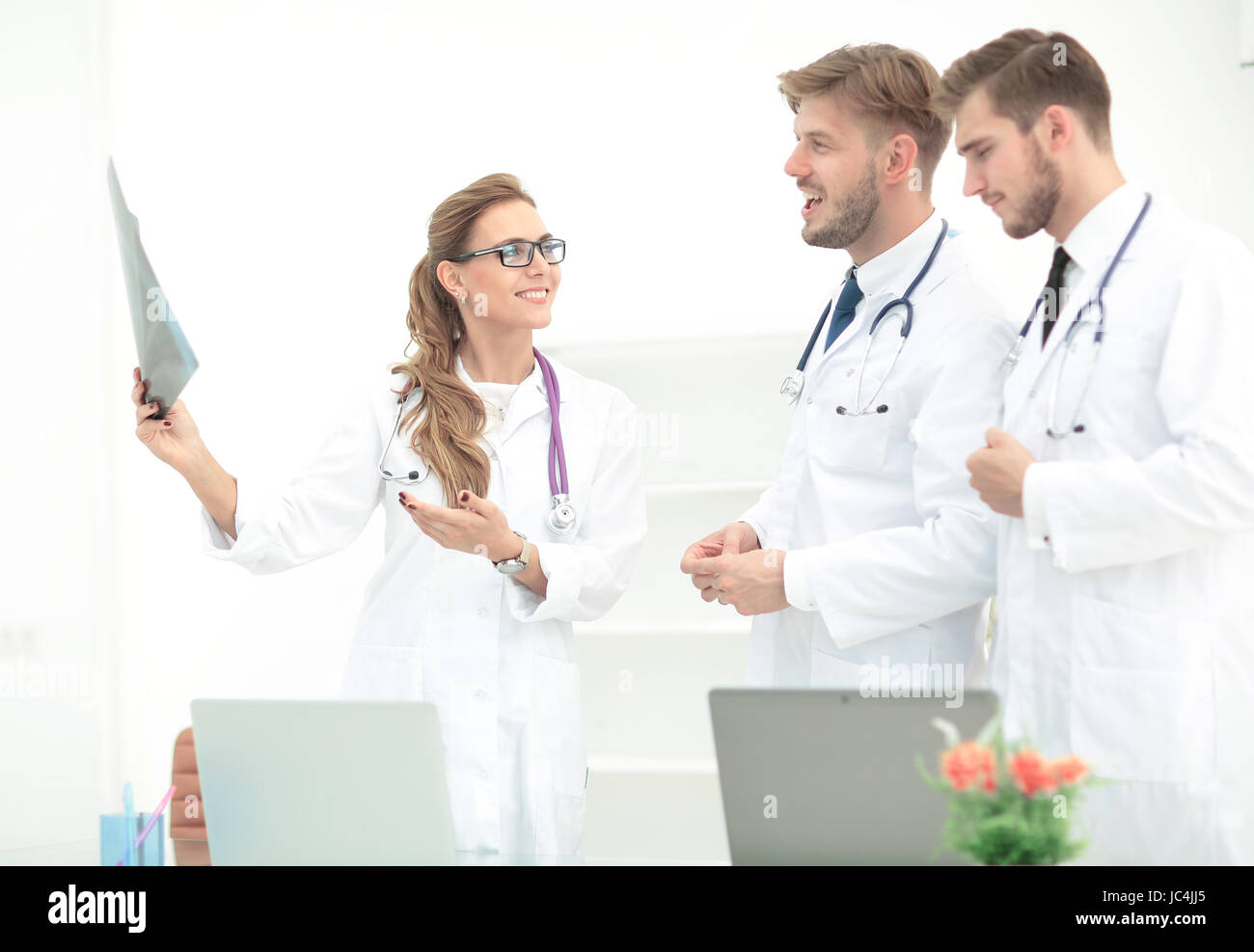 Team of medical professionals working at the medical office Stock Photo ...