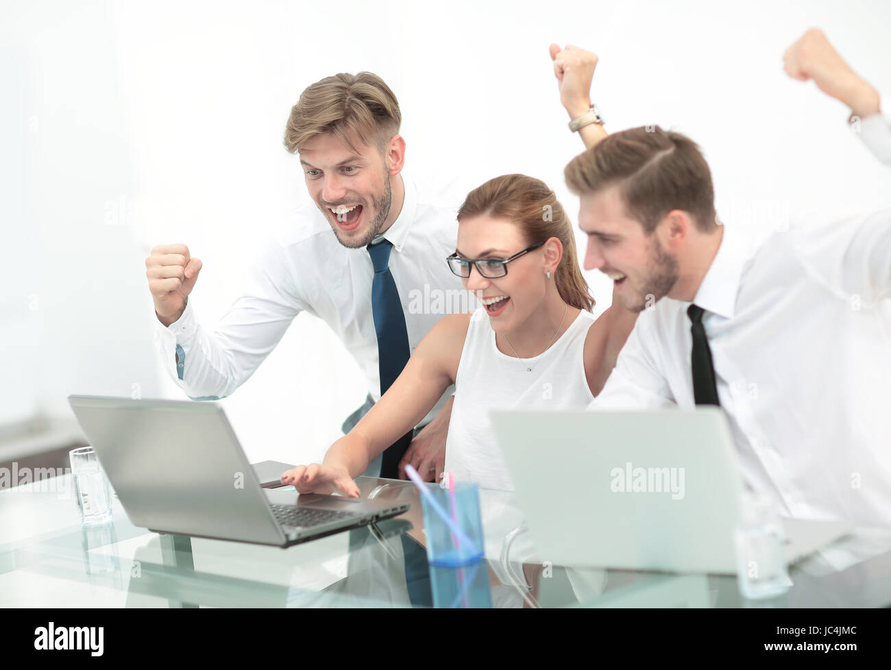 Business team celebrating a triumph with arms up Stock Photo - Alamy