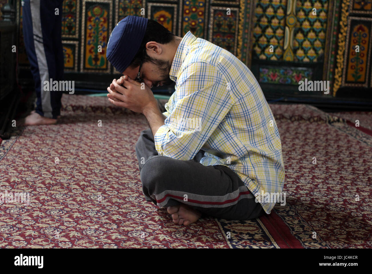 A Kashmiri Muslim man prays during the holy month of Ramadan inside a ...