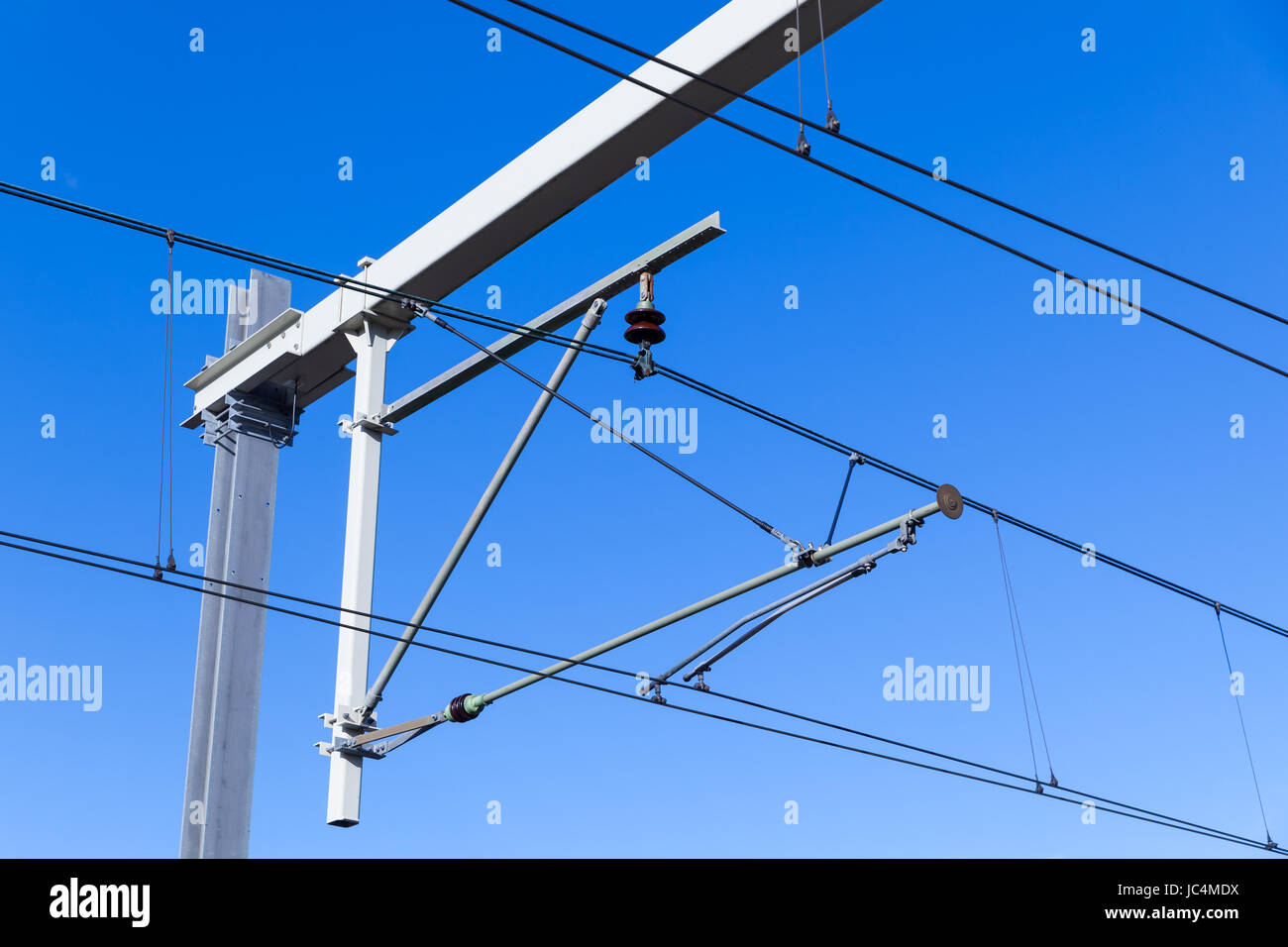 Overhead lines on Dutch railway over blue sky background Stock Photo ...
