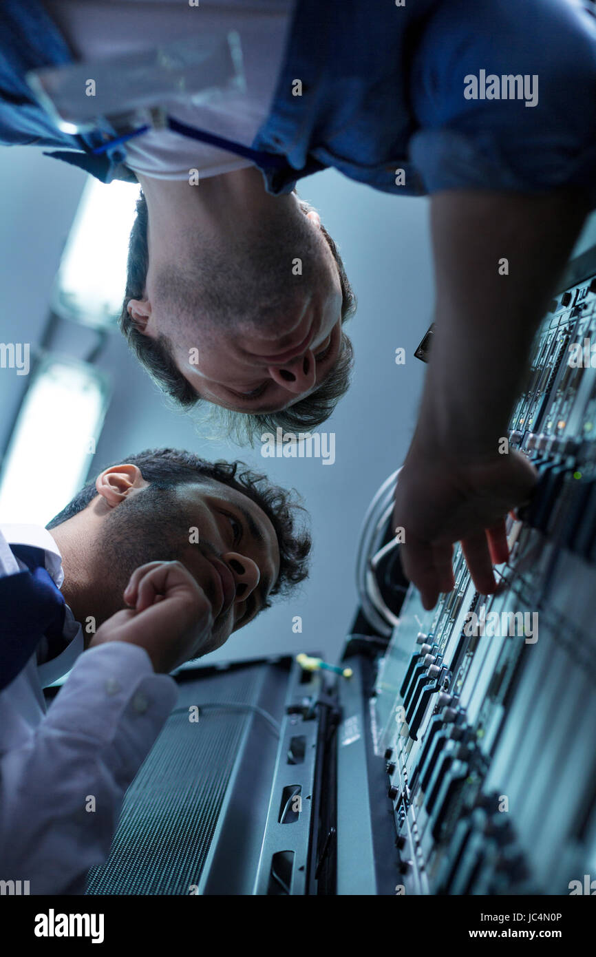 Handsome professional technicians working together Stock Photo - Alamy