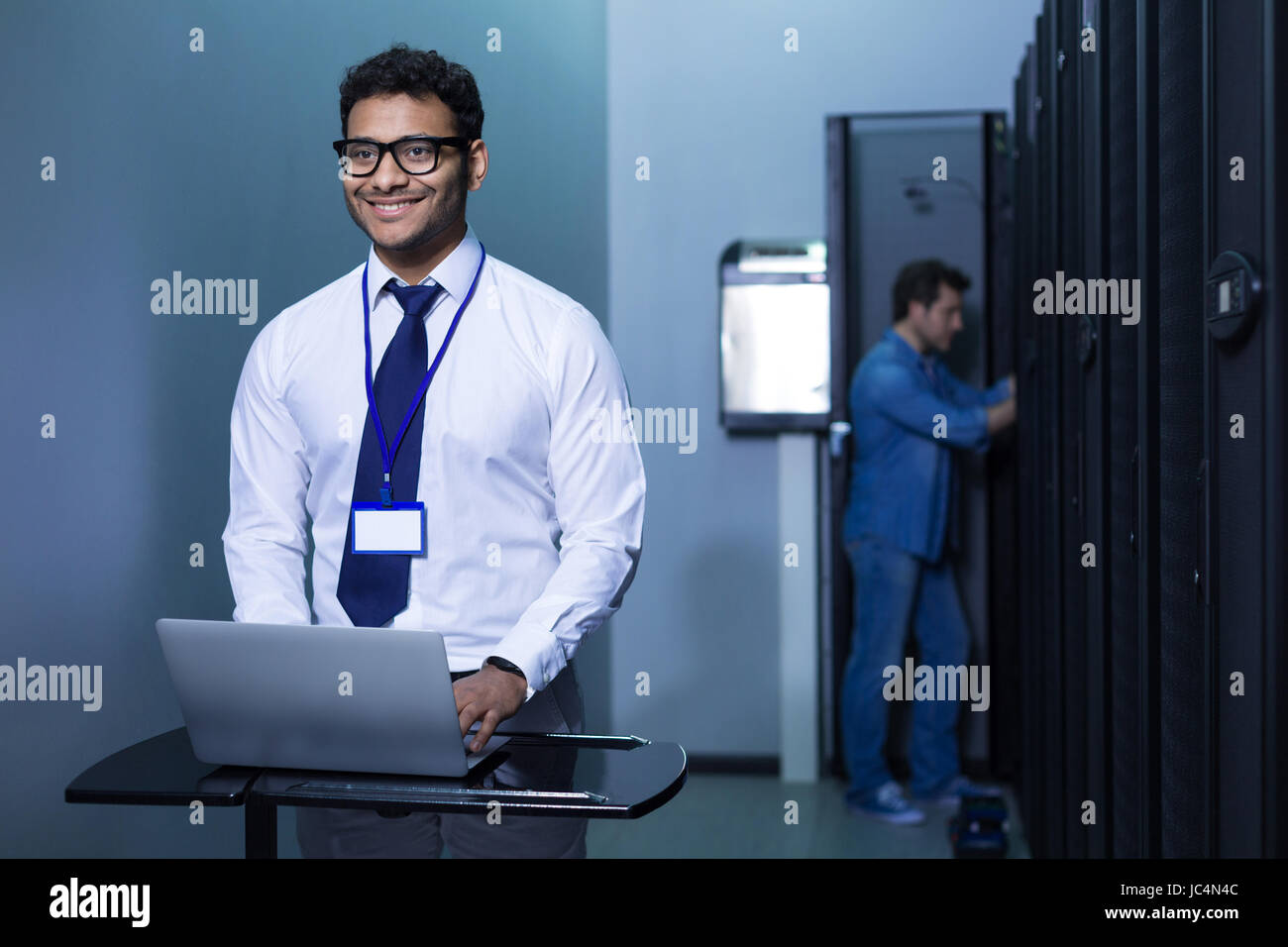 Positive man programmer laptop hi-res stock photography and images - Alamy