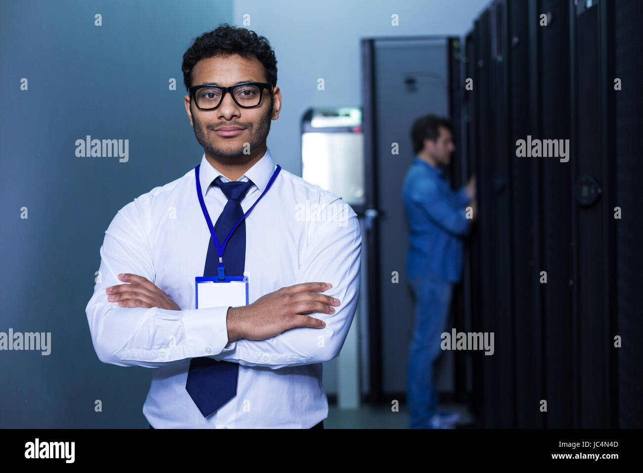 Smart intelligent man crossing his hands Stock Photo - Alamy