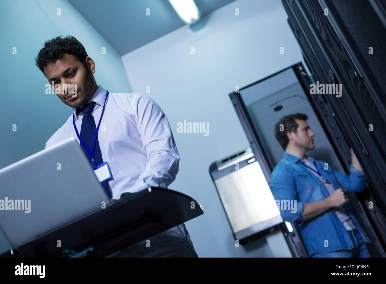 Data center technician using laptop hi-res stock photography and images ...