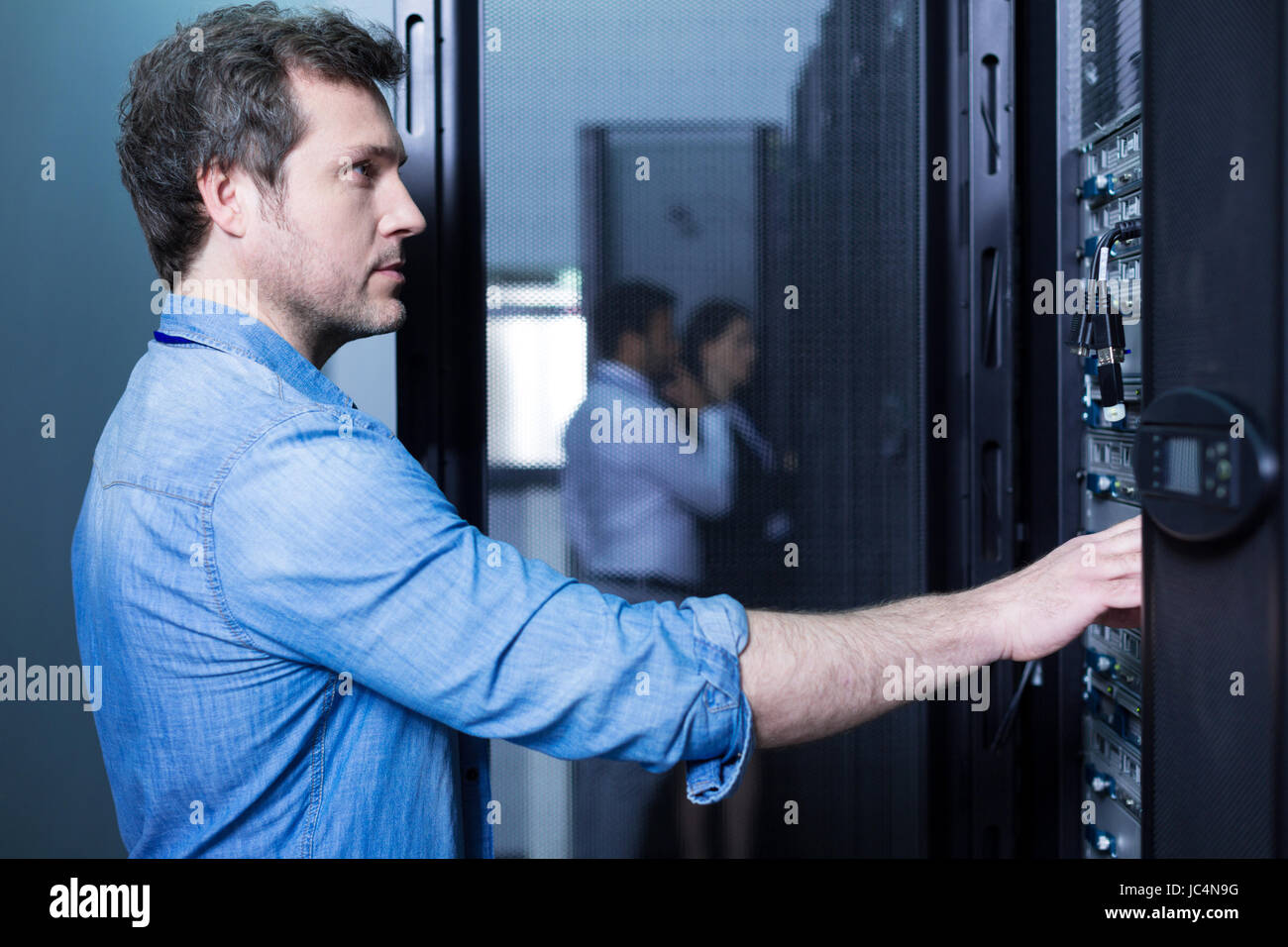 Handsome smart man doing his job Stock Photo - Alamy