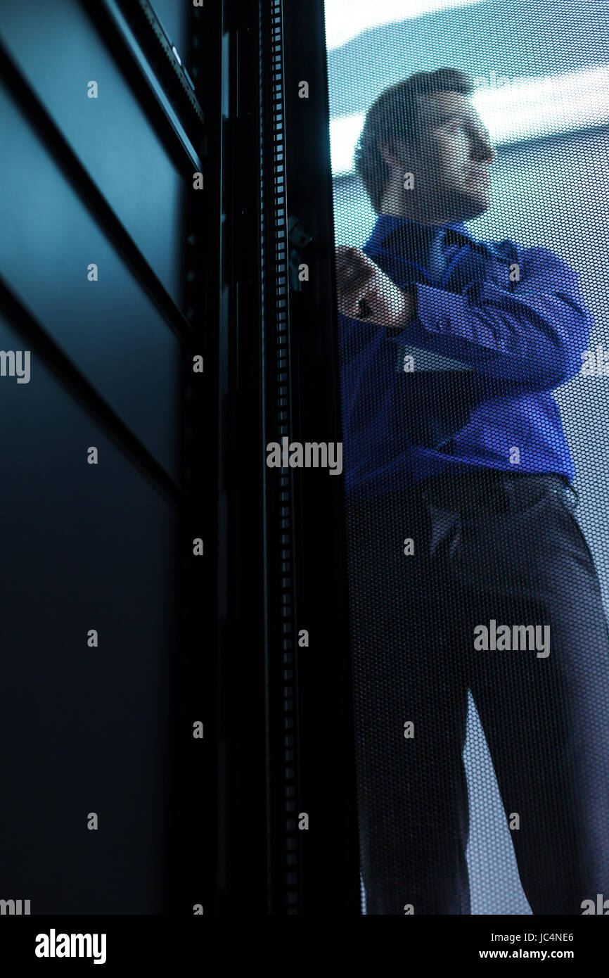 Handsome good looking man standing behind the door Stock Photo - Alamy