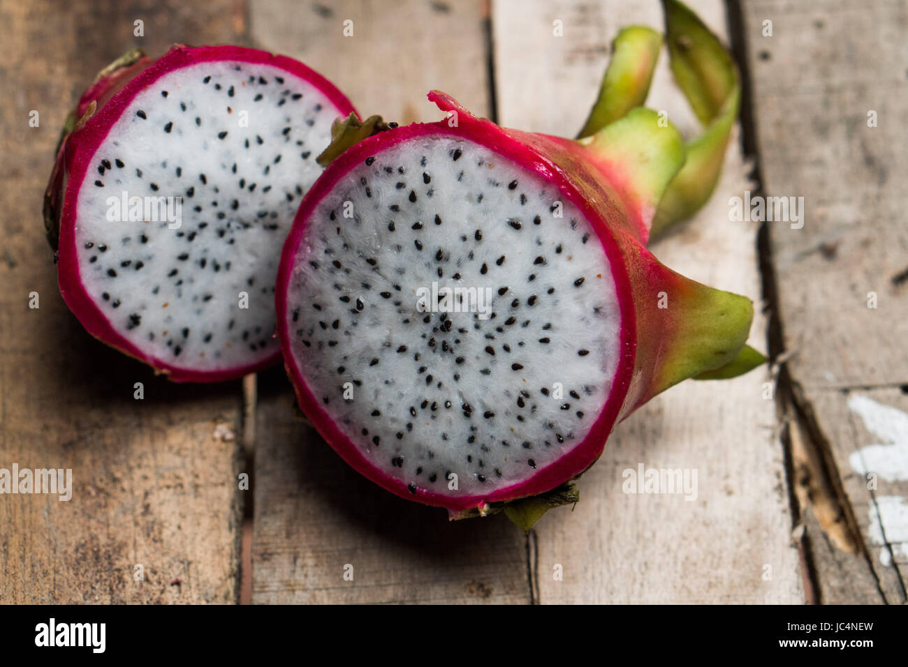 Closeup of dragon fruit isolated on old wooden table background Stock ...