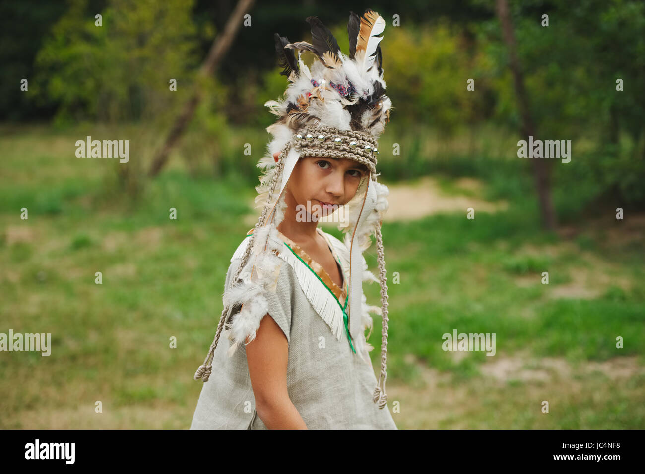 little funny boy playing native american Stock Photo - Alamy