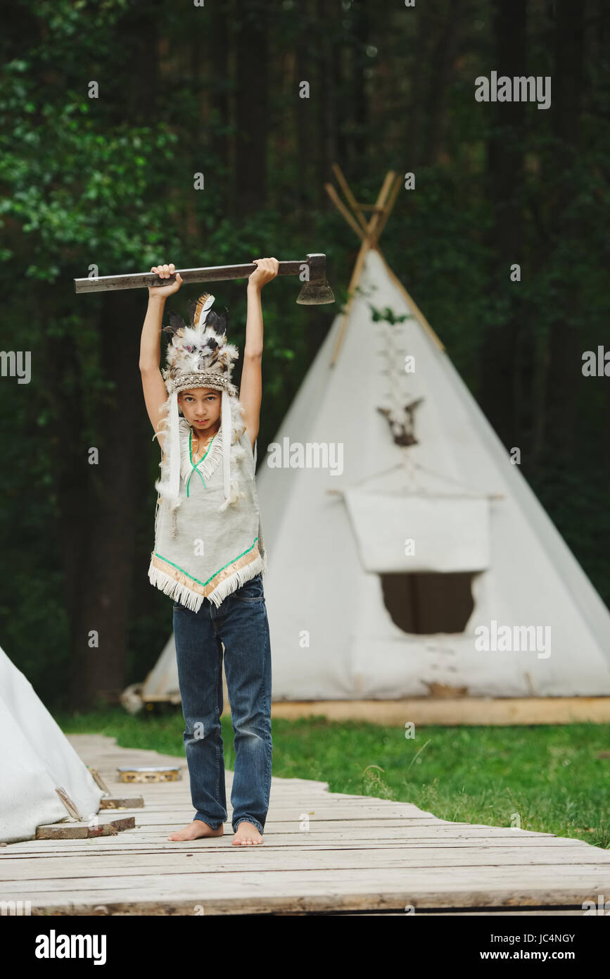 little funny boy playing native american Stock Photo - Alamy