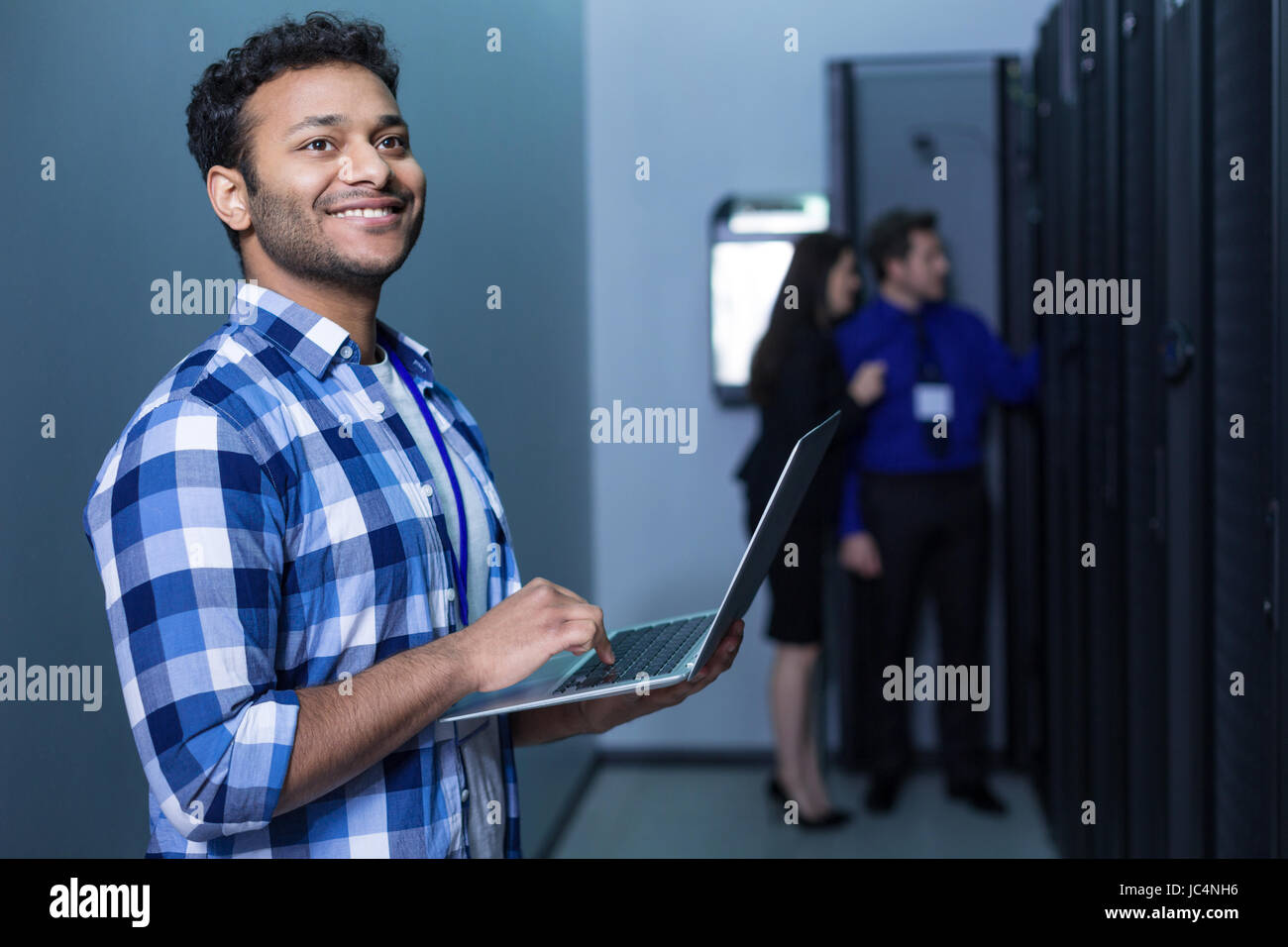 Joyful happy man pressing a button Stock Photo - Alamy