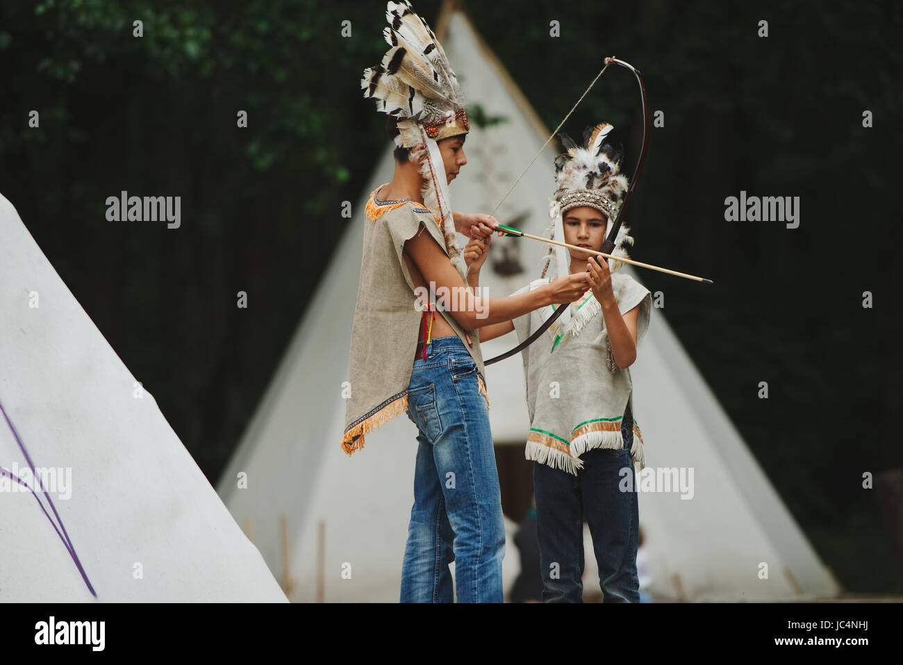 happy children playing native american Stock Photo - Alamy