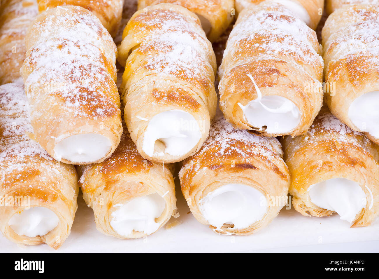 tube of pastry filled with snow, very sweet cookies, traditional czech ...