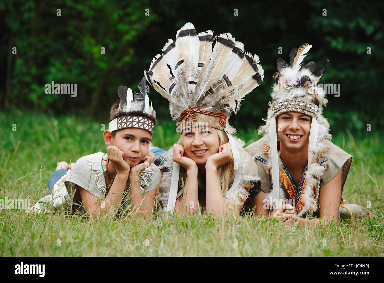 Happy children playing native american hi-res stock photography and ...