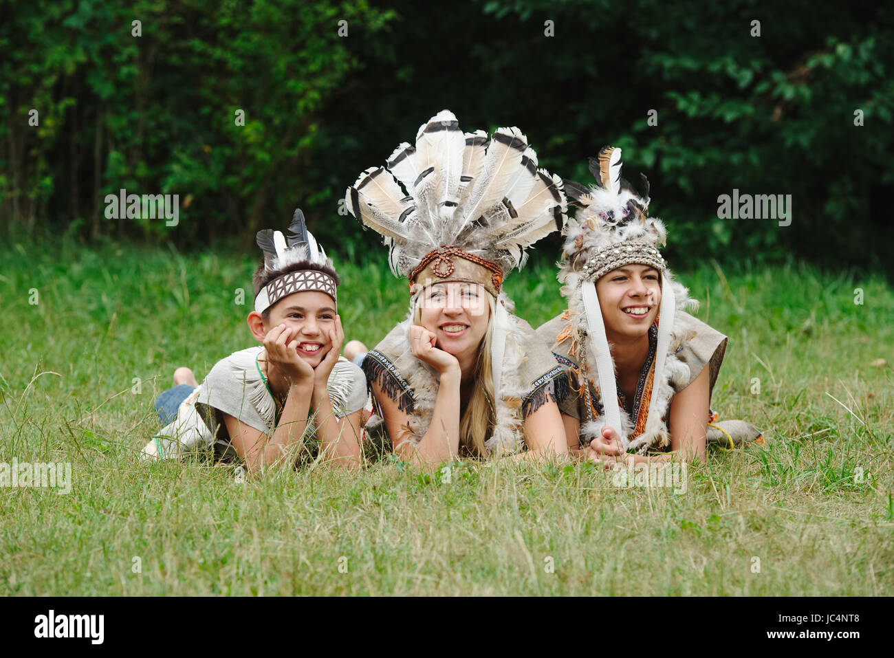 Happy children playing native american hi-res stock photography and ...