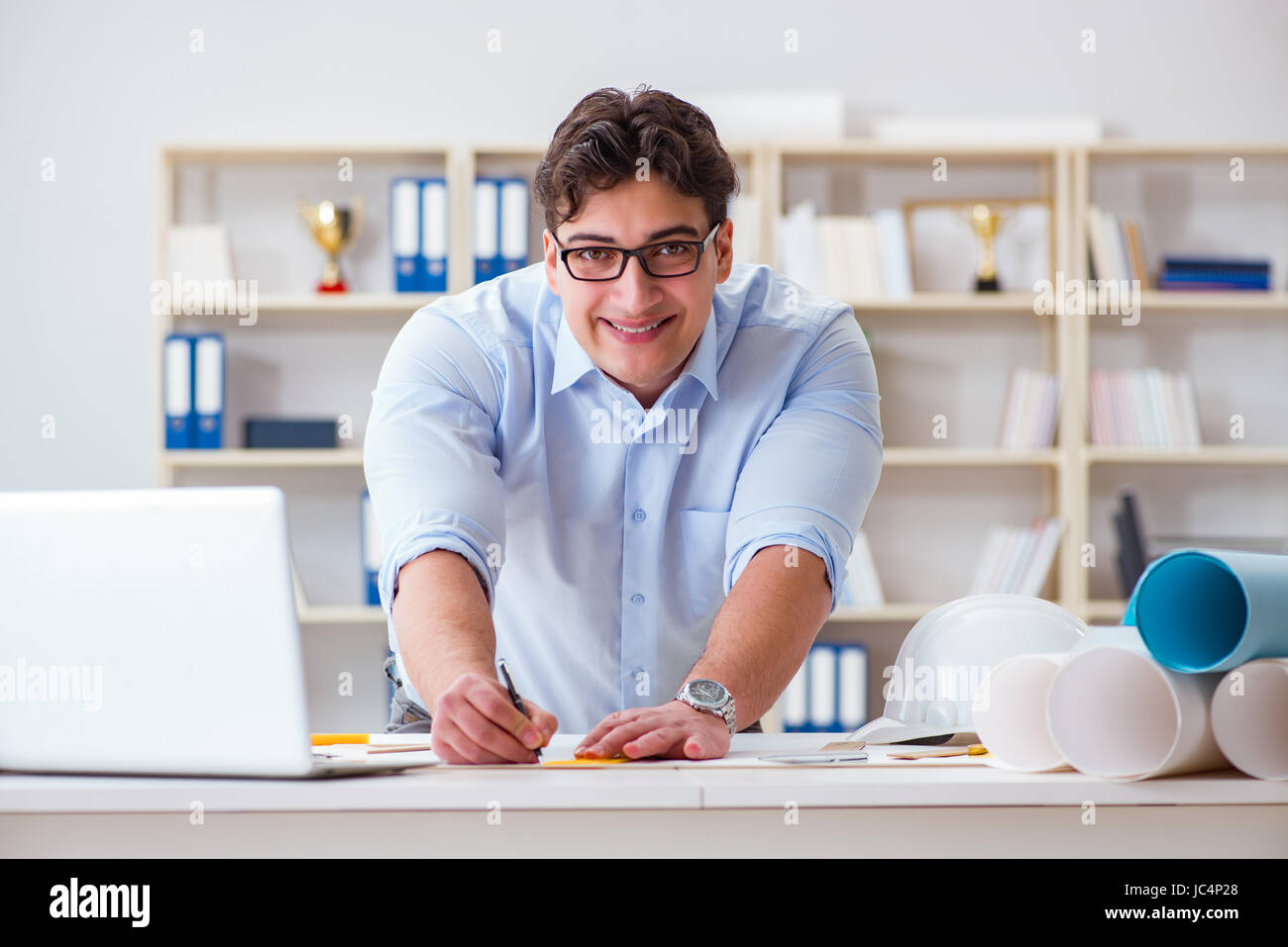 Male engineer working on drawings and blueprints Stock Photo - Alamy
