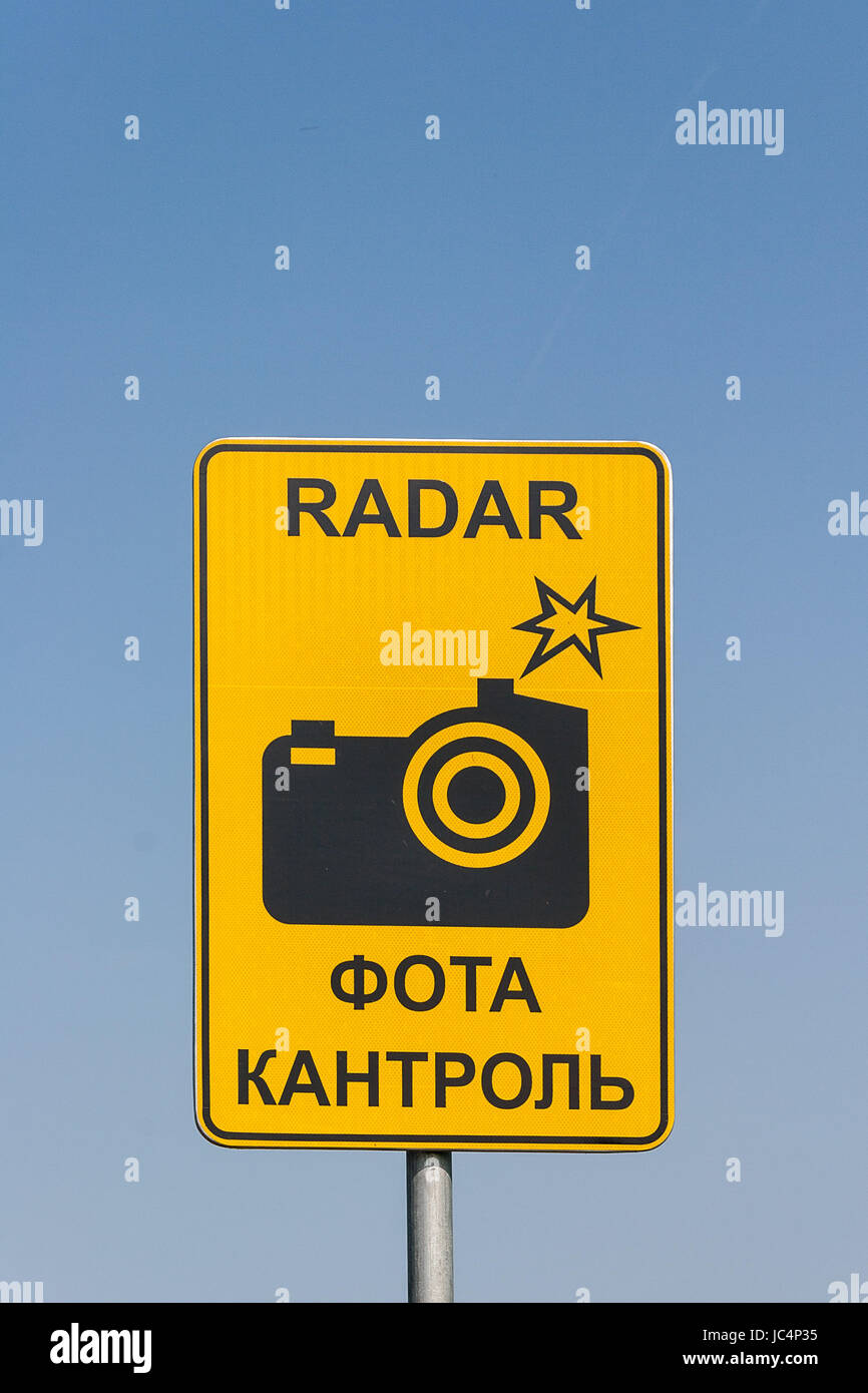 Yellow Radar road sign. Warning about cameras ahead Stock Photo - Alamy
