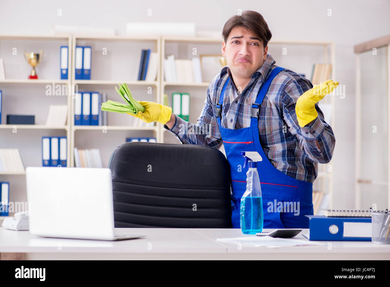 Male cleaner working in the office Stock Photo - Alamy