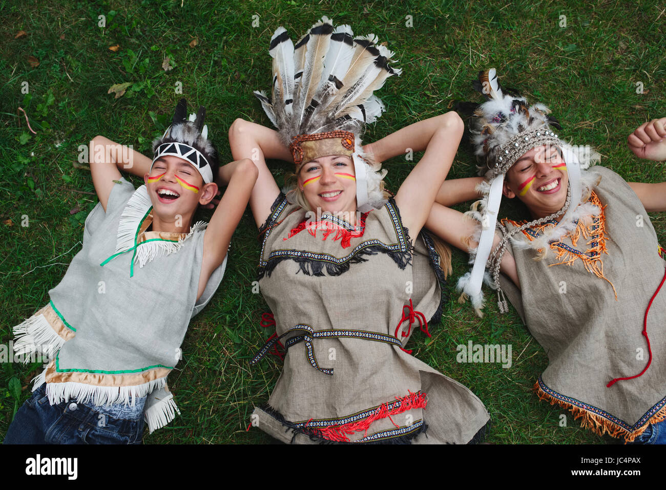 Happy children playing native american hi-res stock photography and ...