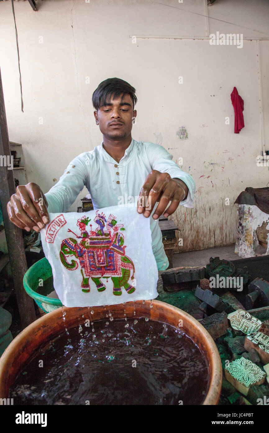 Man in India,New Delhi is stamping patterns on fabric in Factory in ...