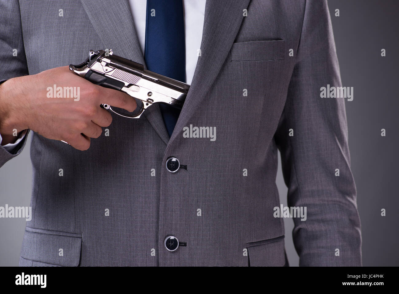 Man pulling out gun from hi-res stock photography and images - Alamy