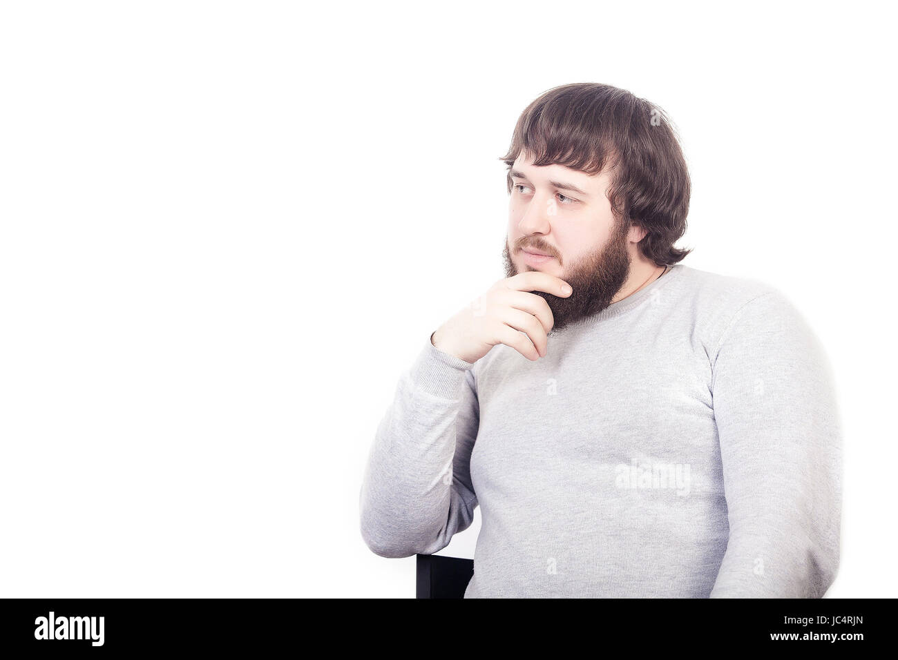 Handsome young thoughtful man isolated over white background Stock ...