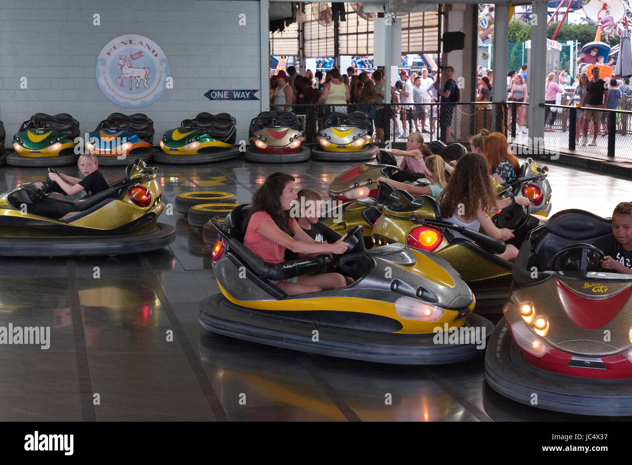 Electric bumper cars collide at an amusement center in Rehoboth Beach ...