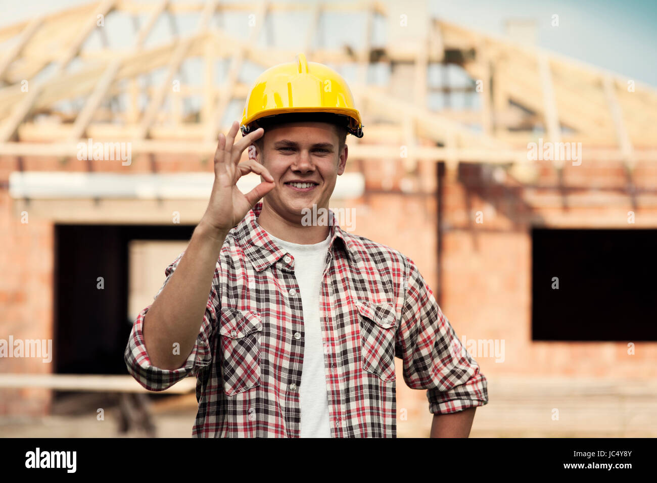 Construction worker showing ok sign Stock Photo - Alamy
