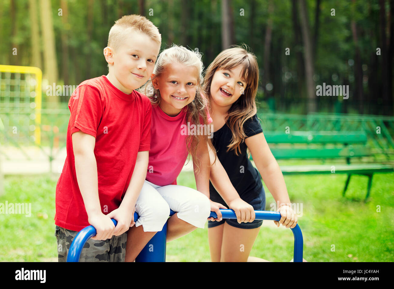 Happy children on playground Stock Photo - Alamy