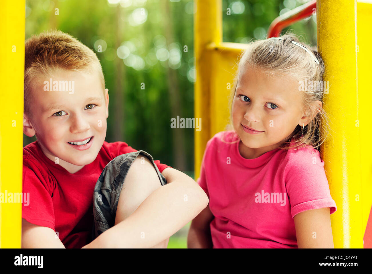 Friends resting on playground Stock Photo - Alamy