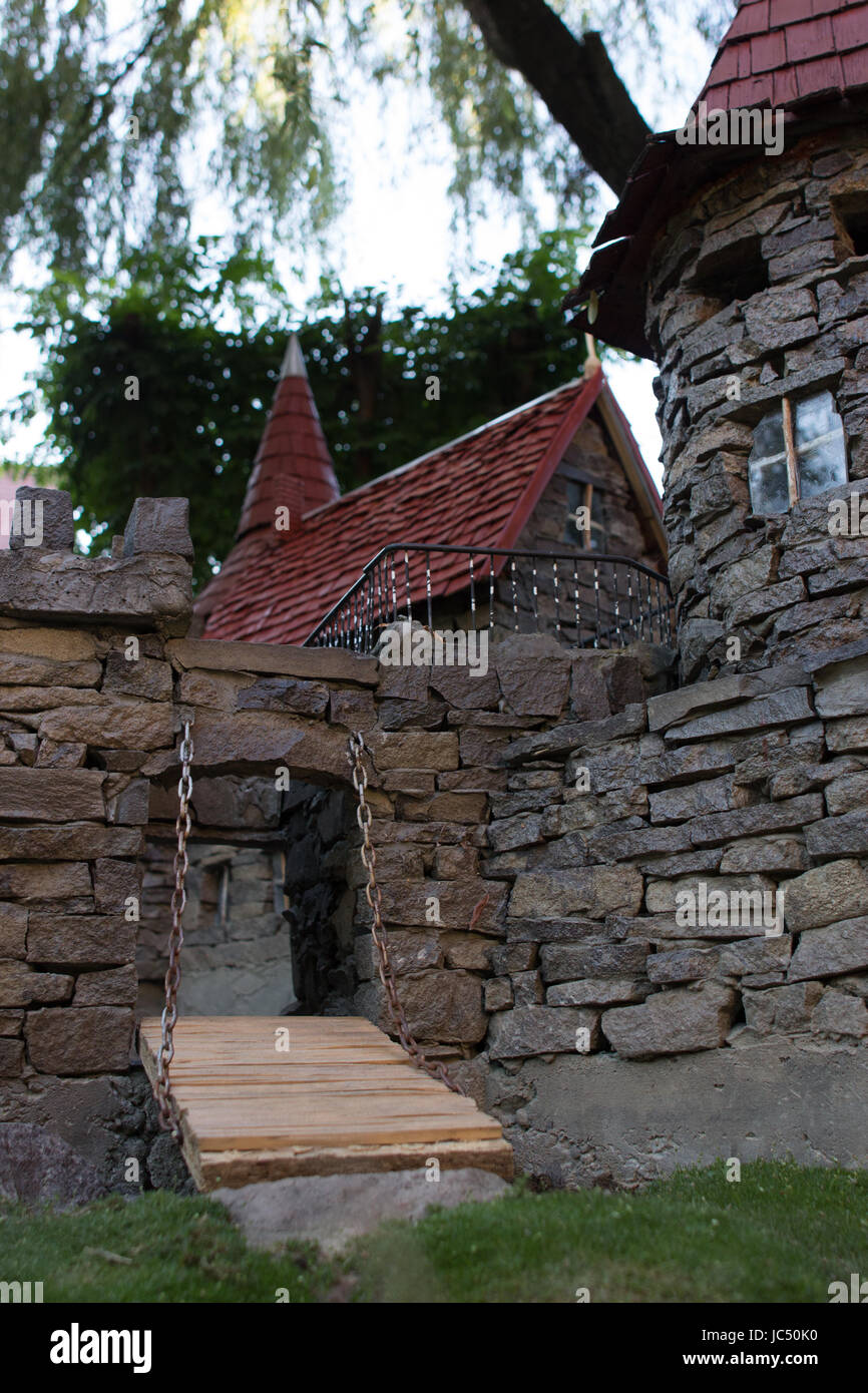 small model of old medieval castle in a miniature with bridge over ...