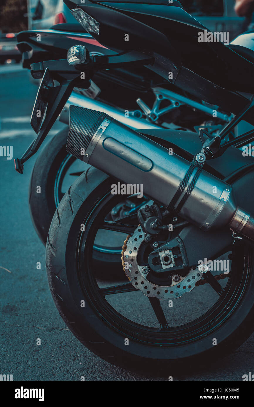 Close up shot of rear motorcycle wheel with tyre, disk brake and ...