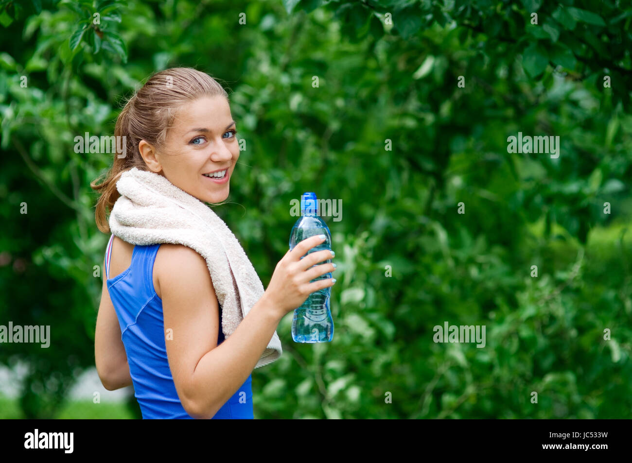 Smiling woman after workout Stock Photo - Alamy