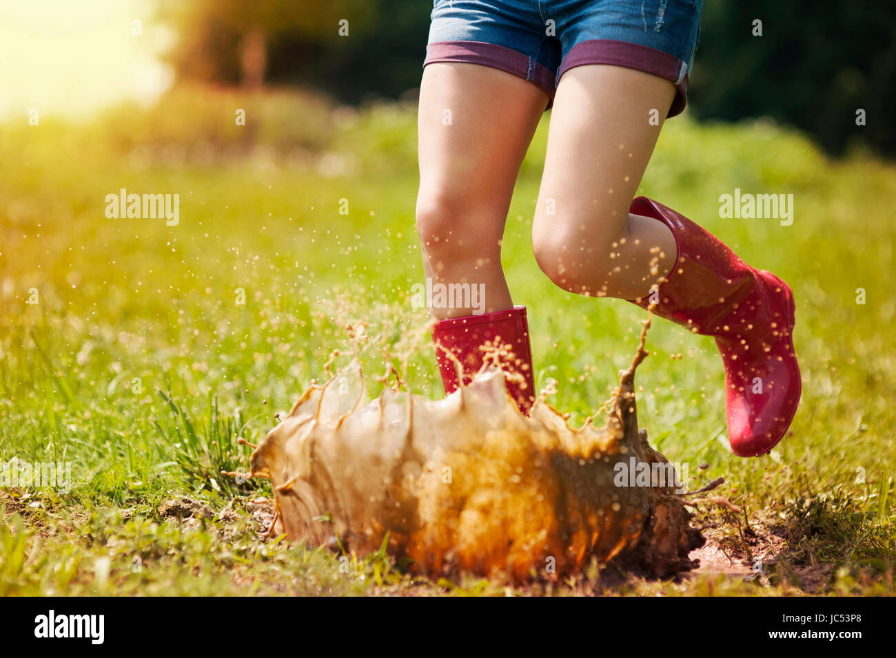 Puddle jumping in red rain hi-res stock photography and images - Alamy