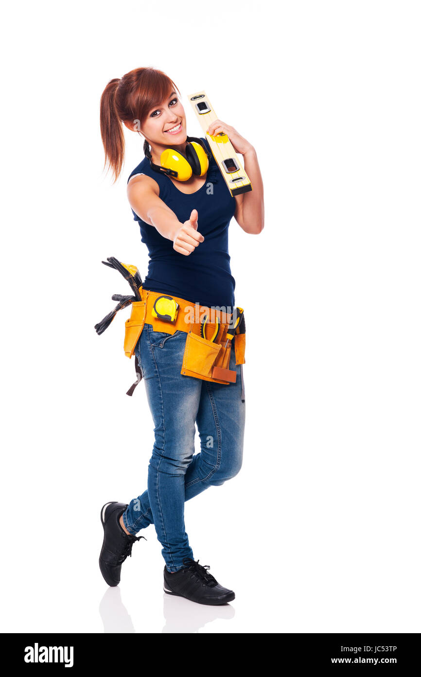 Young female construction worker showing OK sign Stock Photo - Alamy