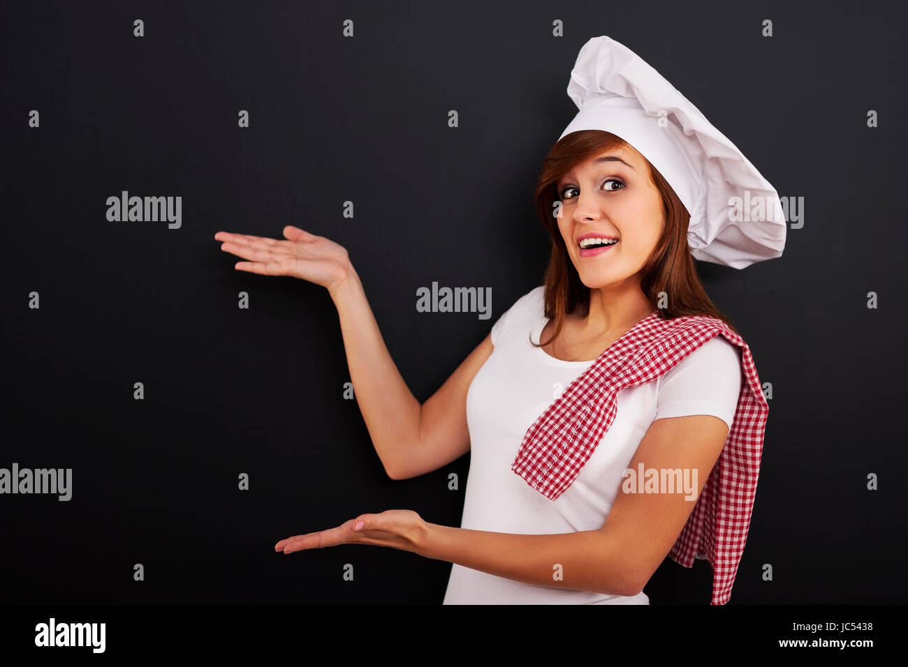 Chef showing blank menu on blackboard Stock Photo - Alamy