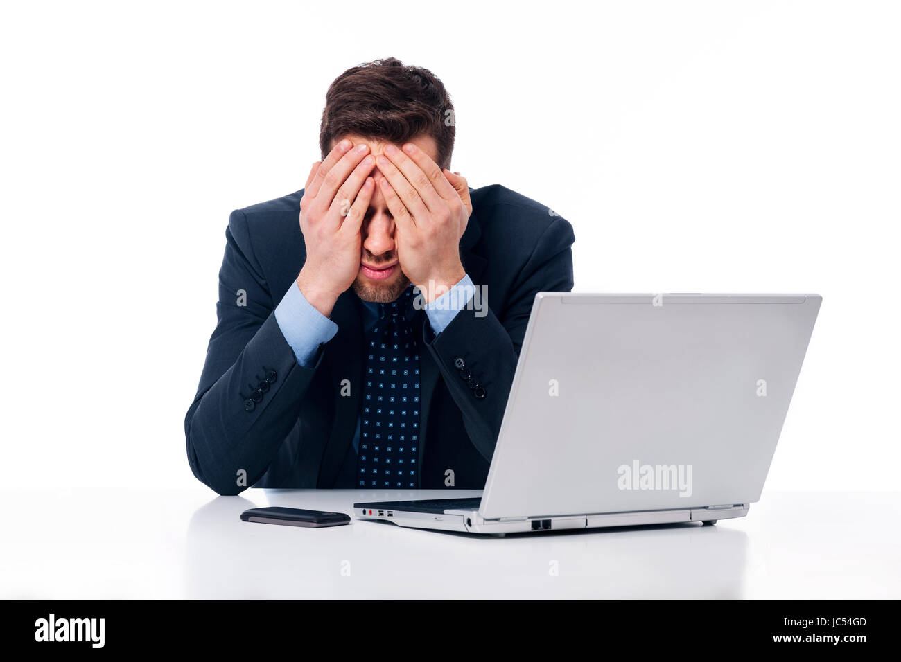 Tired businessman at work Stock Photo - Alamy