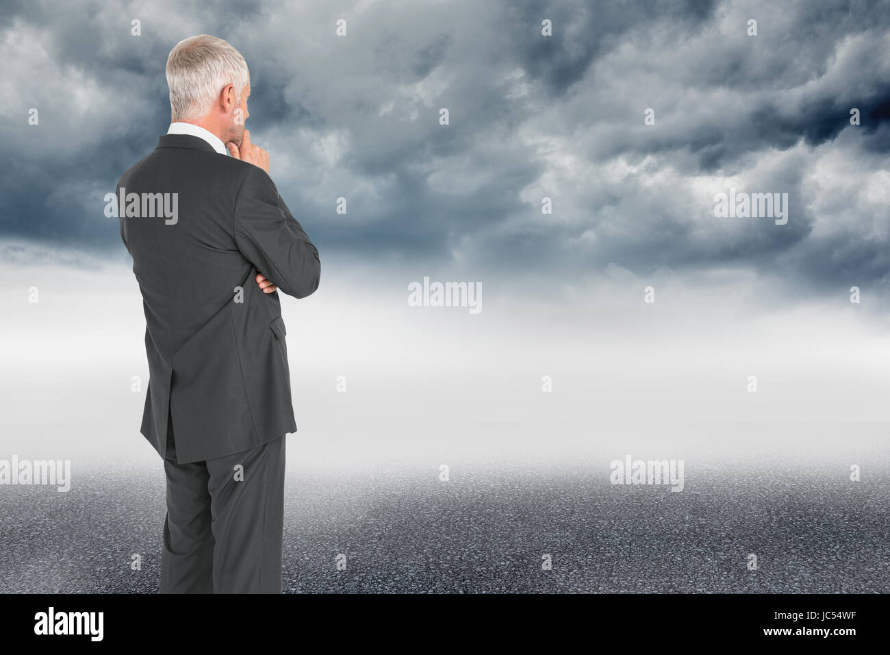 Composite image of thoughtful businessman standing back to camera Stock ...