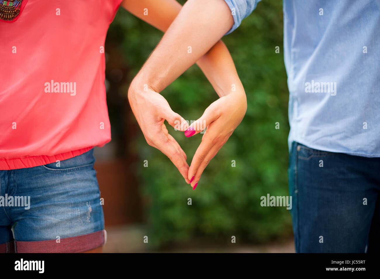 Heart shape made from hands Stock Photo - Alamy