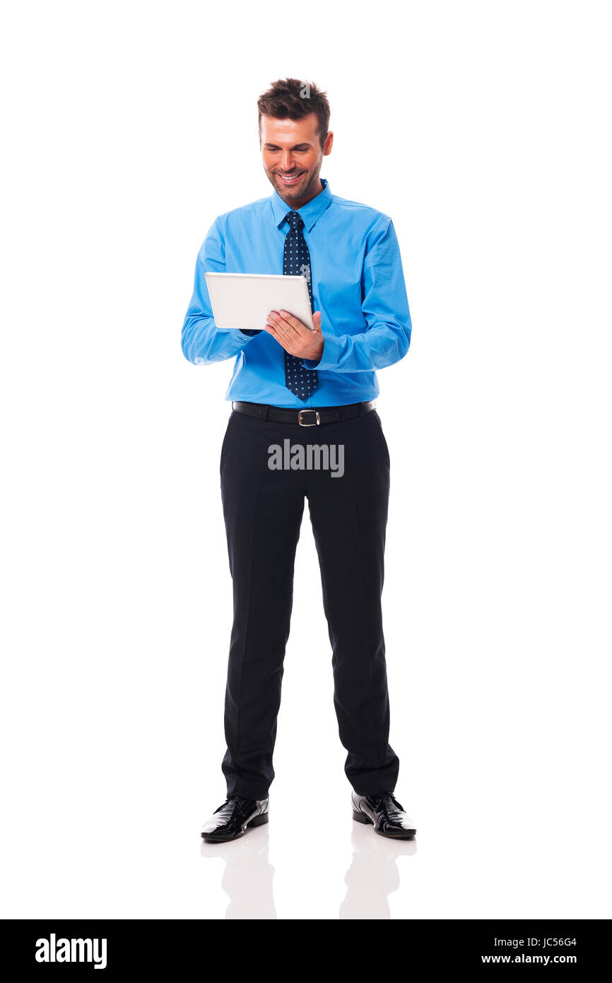 Man checking something on his tablet Stock Photo - Alamy