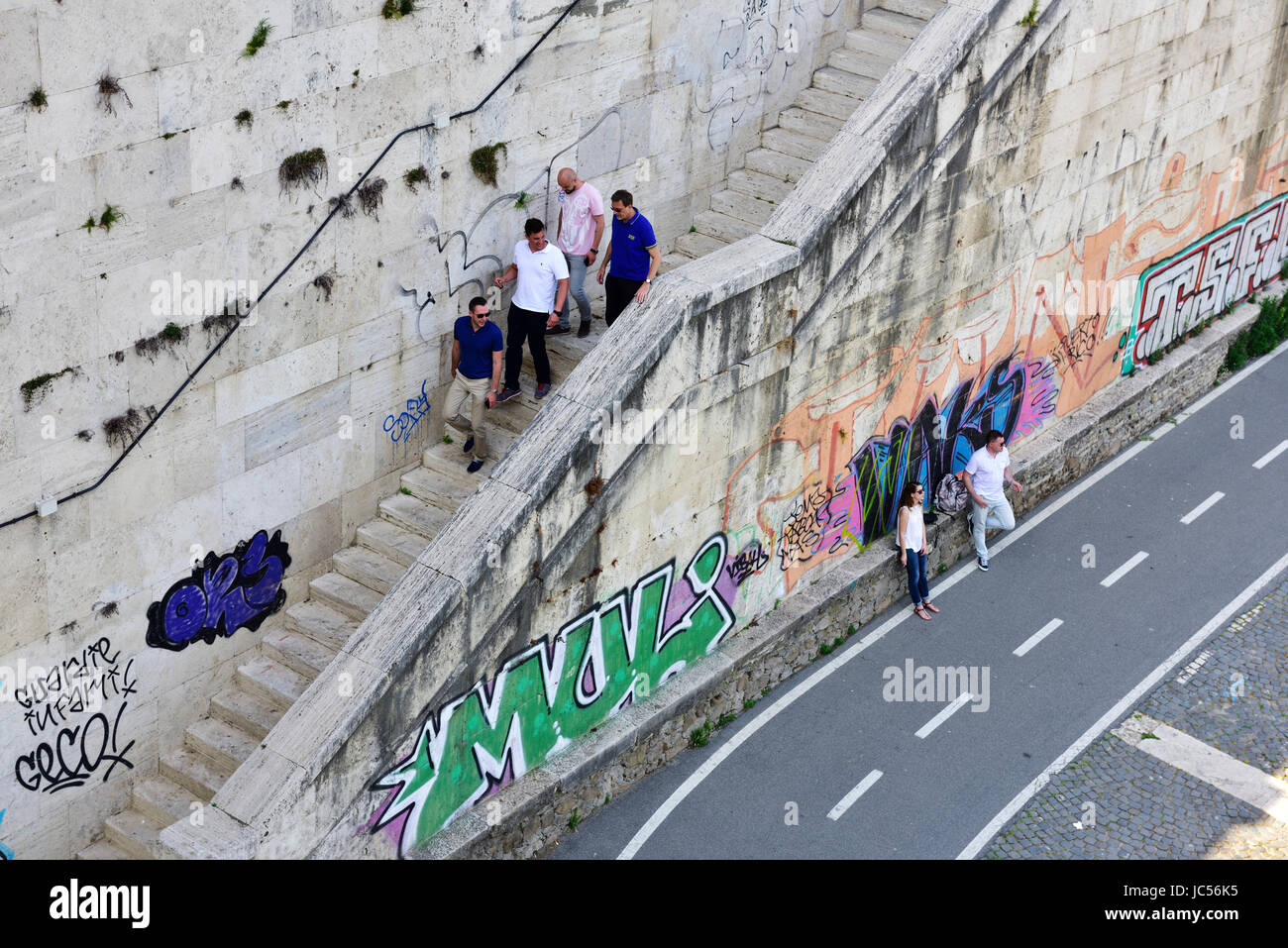 Steps with people walking down, graffiti Stock Photo - Alamy