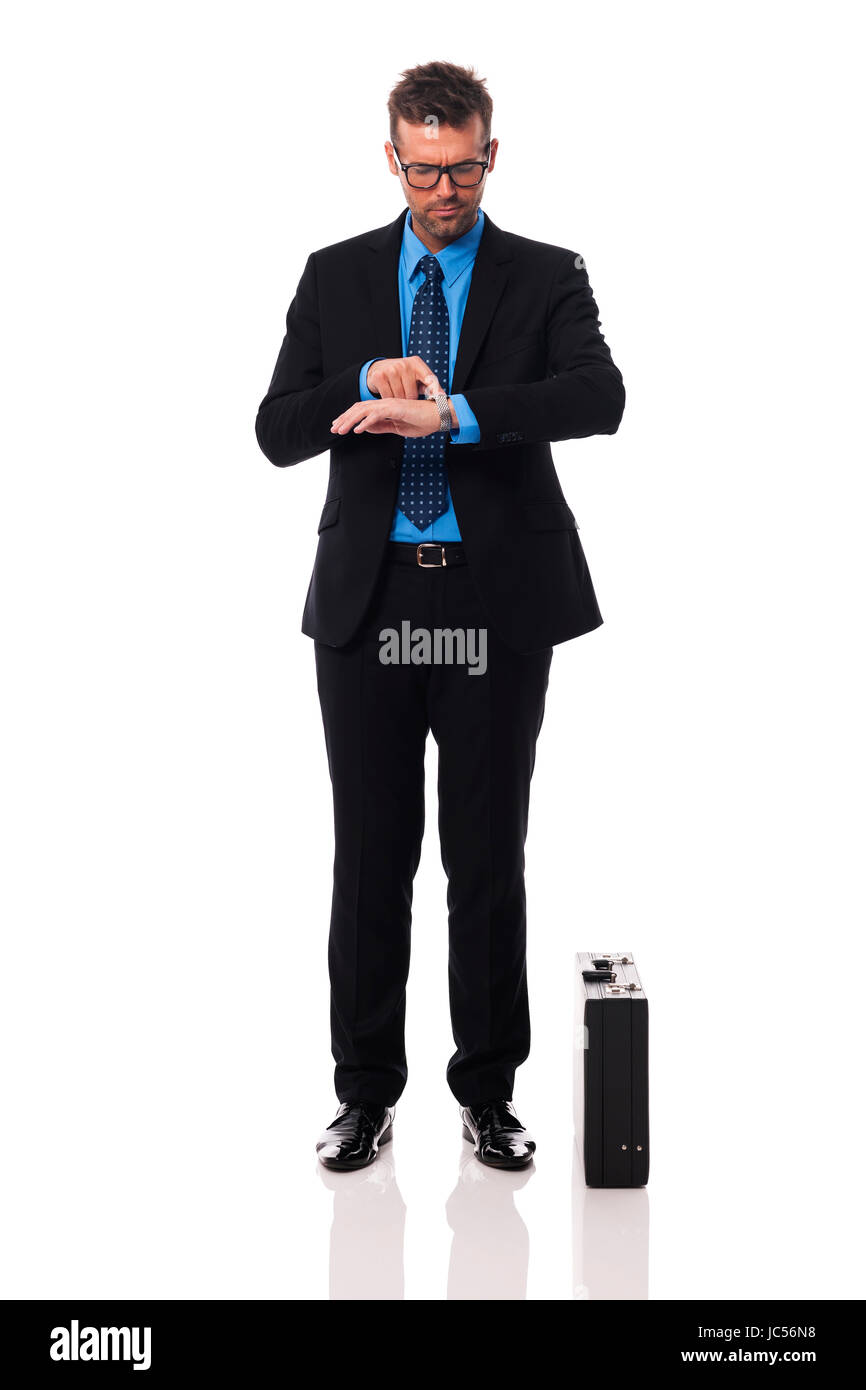 Office worker checking watch Cut Out Stock Images & Pictures - Alamy