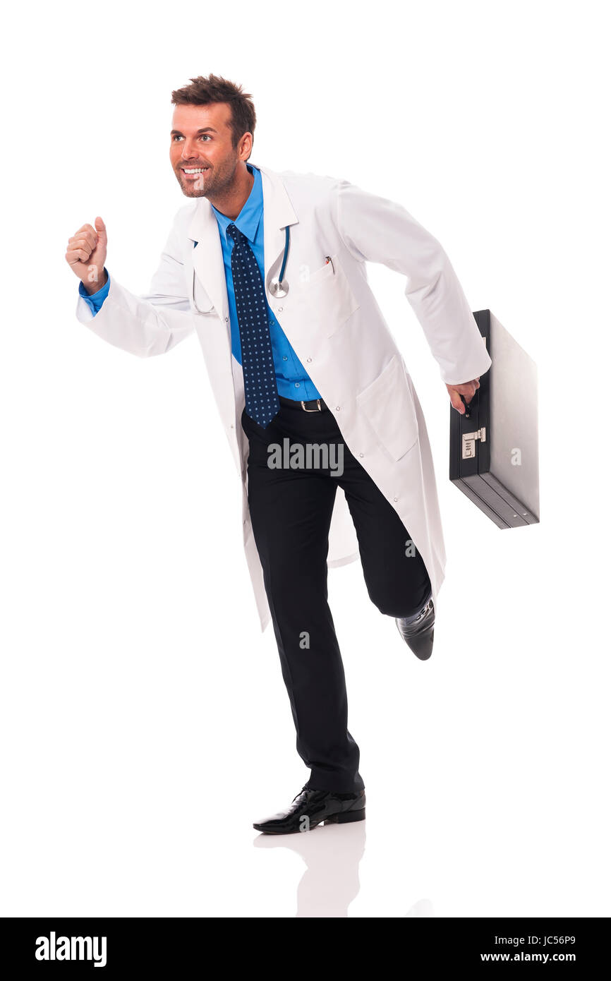 Smiling doctor running to his patients Stock Photo - Alamy