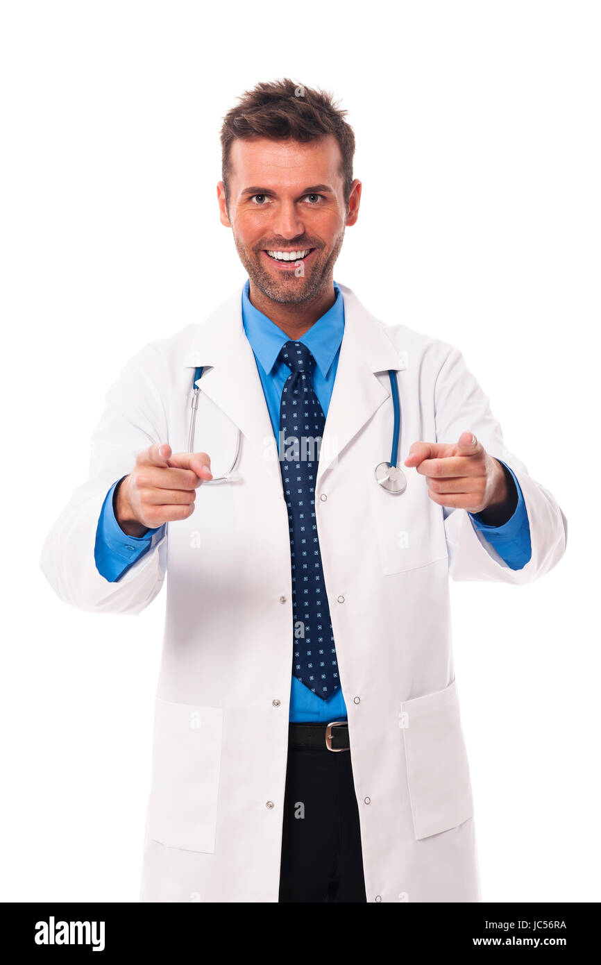 Smiling male doctor pointing at you Stock Photo - Alamy