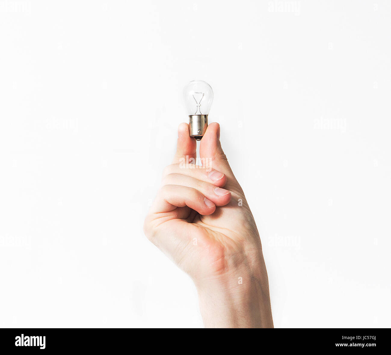hand hold small light bulb on a white background, isolated, idea Stock ...