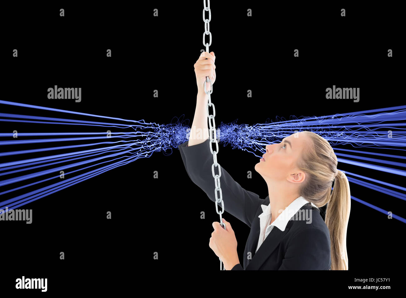 Composite image of blonde businesswoman pulling a chain Stock Photo - Alamy