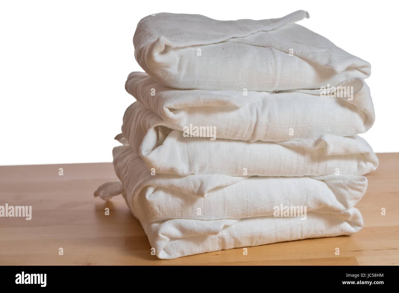 Stack of classical square white cloth diapers on white background ...