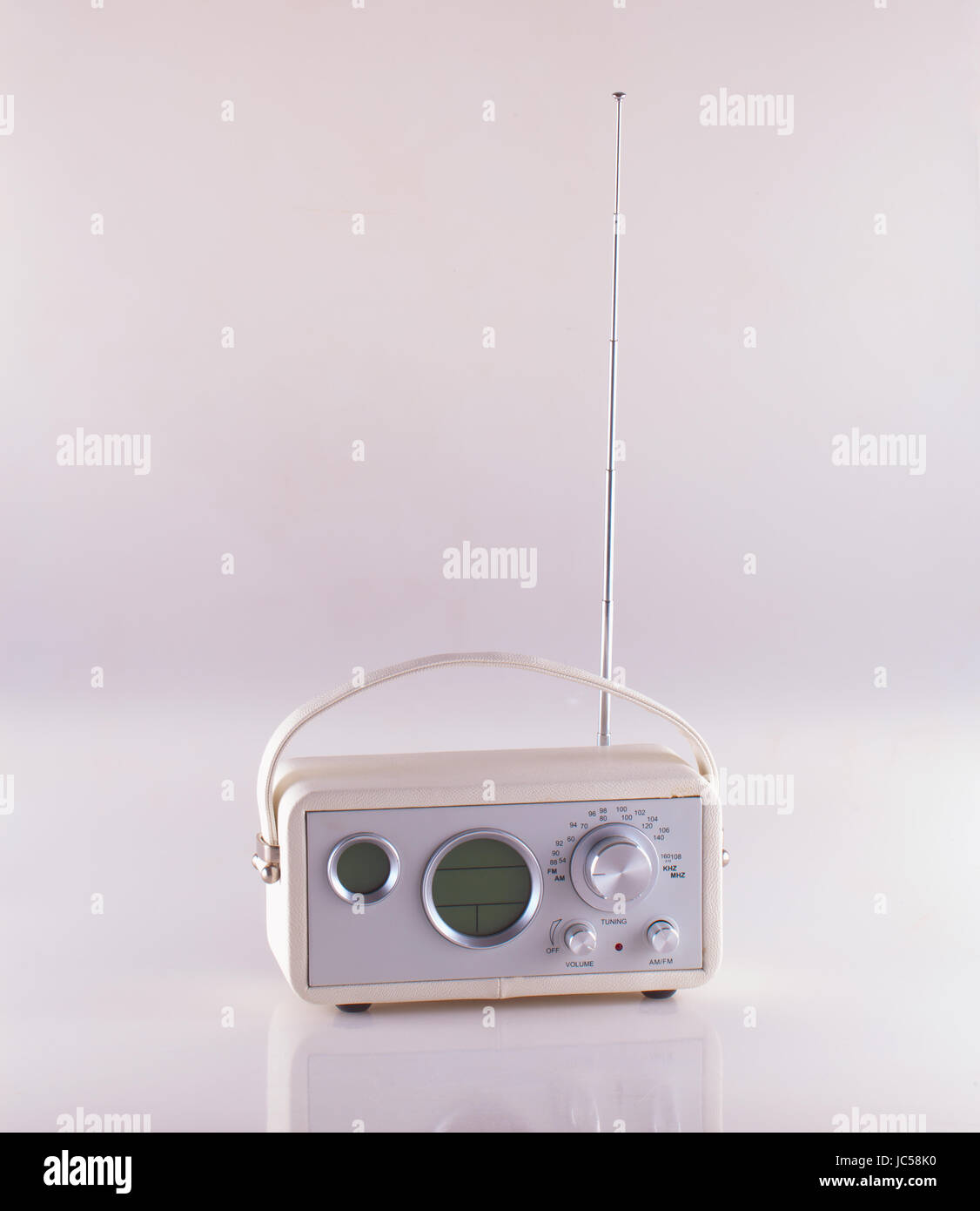 White vintage radio over white reflecting background Stock Photo - Alamy
