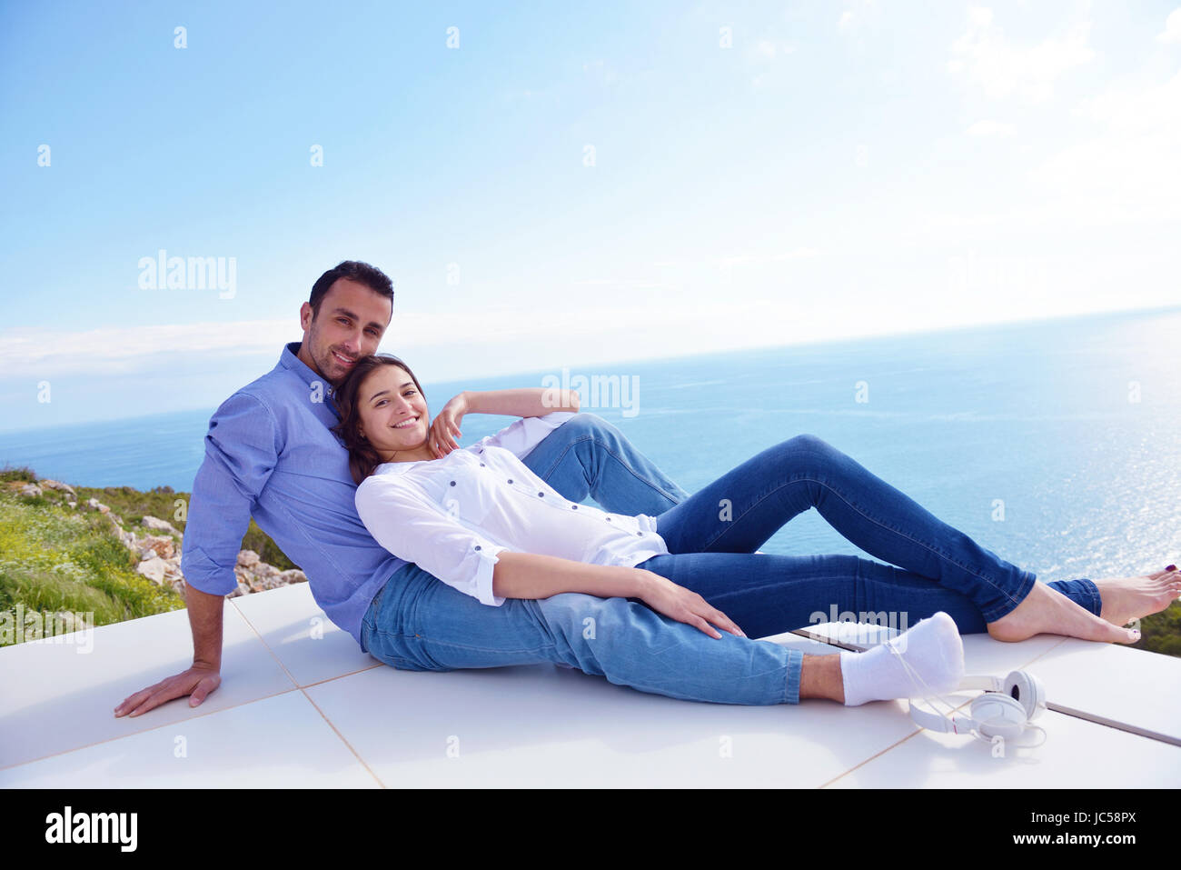 romantic happy young couple relax at modern home outdoors Stock Photo ...
