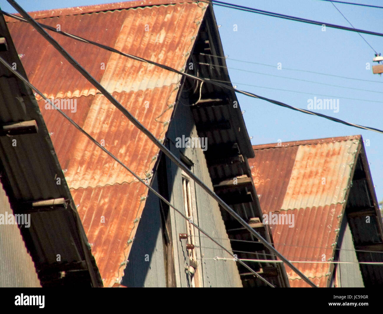Rusty Corrugated Triangle Roofs with Unsightly Wires and Lines Stock ...
